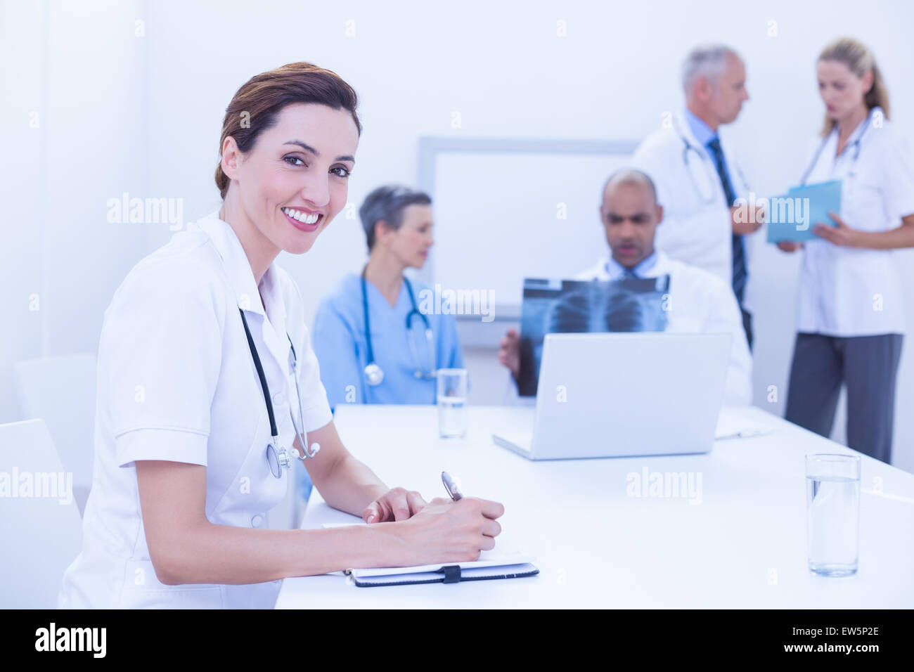 Portrait female doctors writing hi-res stock photography and images - Alamy