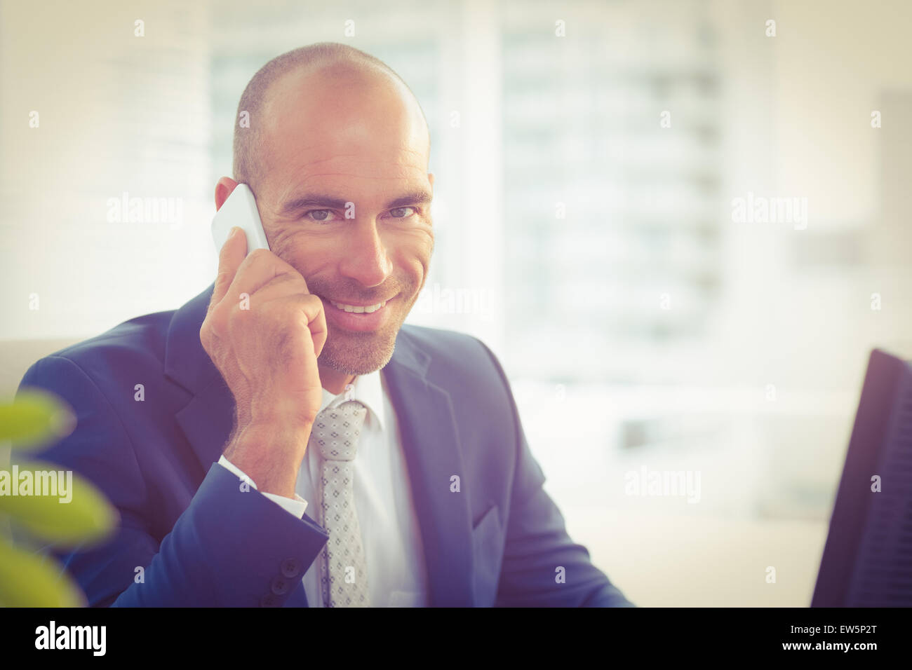 Smiling businessman calling on the phone Stock Photo - Alamy
