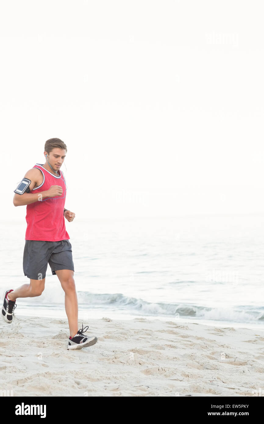 Handsome fit man running Stock Photo - Alamy