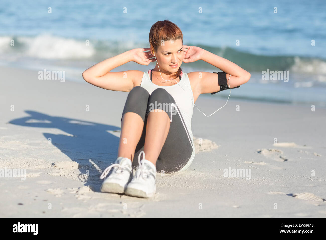 Fit woman doing sit up Stock Photo - Alamy