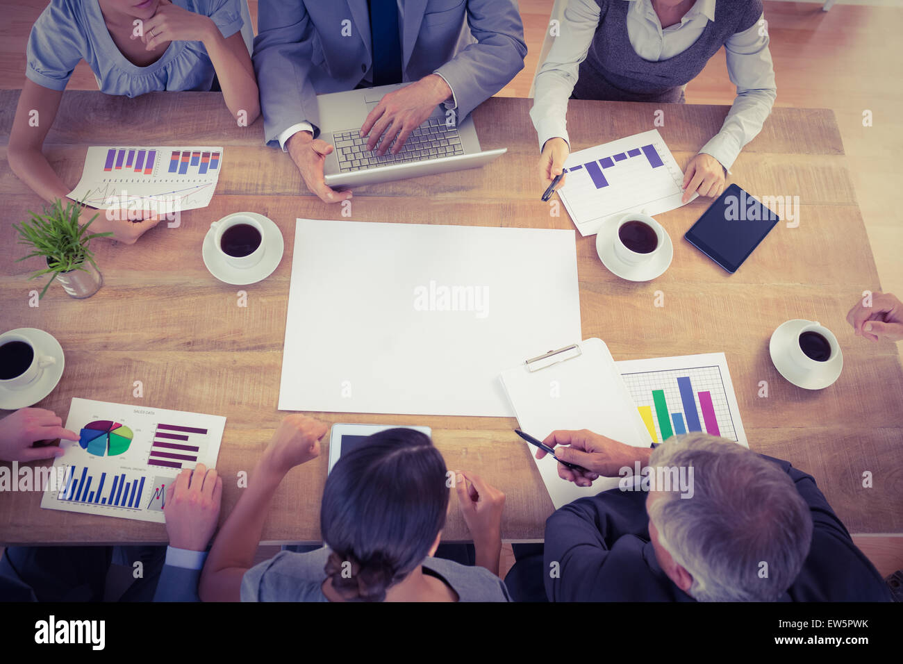 Business team working on their multimedia devices Stock Photo - Alamy