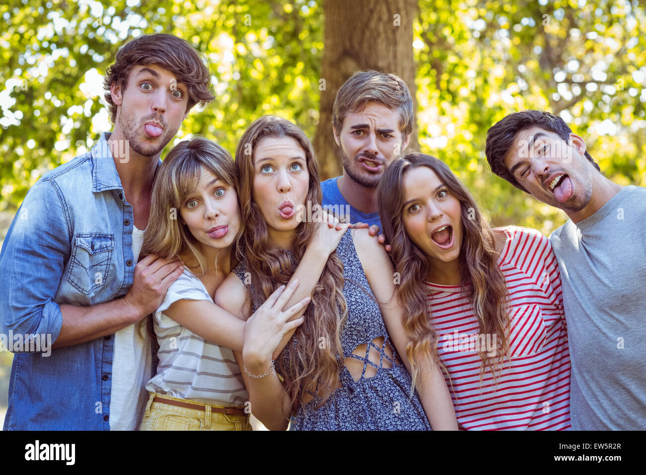 Happy friends in the park Stock Photo - Alamy