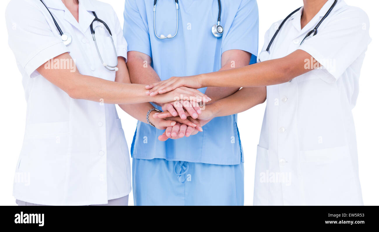 Doctors and nurse putting their hands together Stock Photo - Alamy