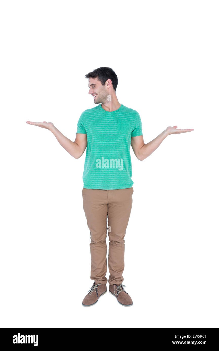 Handsome man showing something with his hands Stock Photo - Alamy