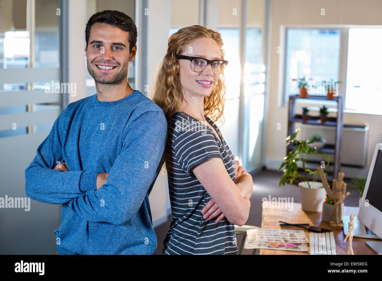 Portrait of smiling partners posing together Stock Photo - Alamy