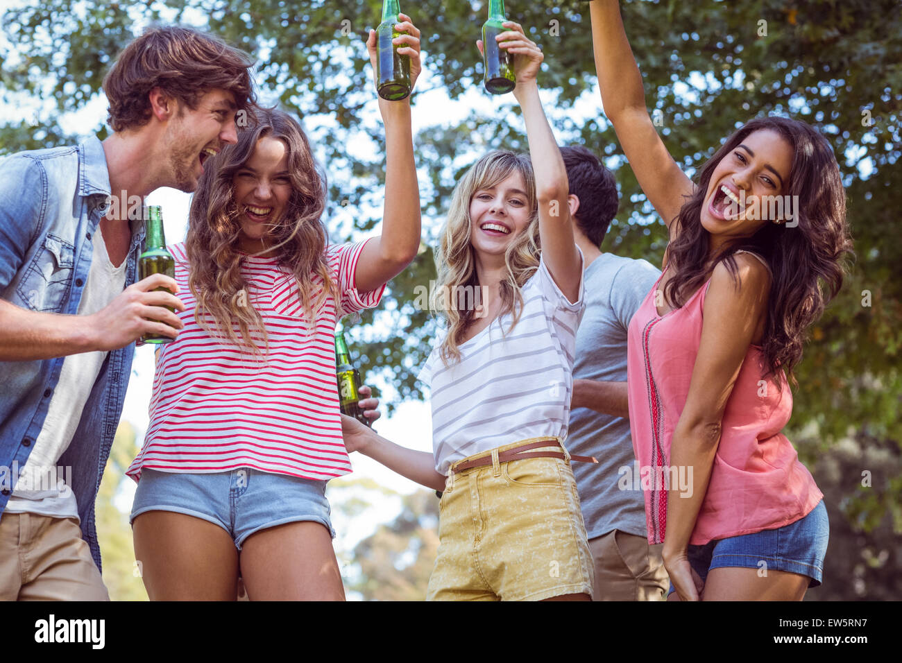 Happy friends in the park Stock Photo - Alamy