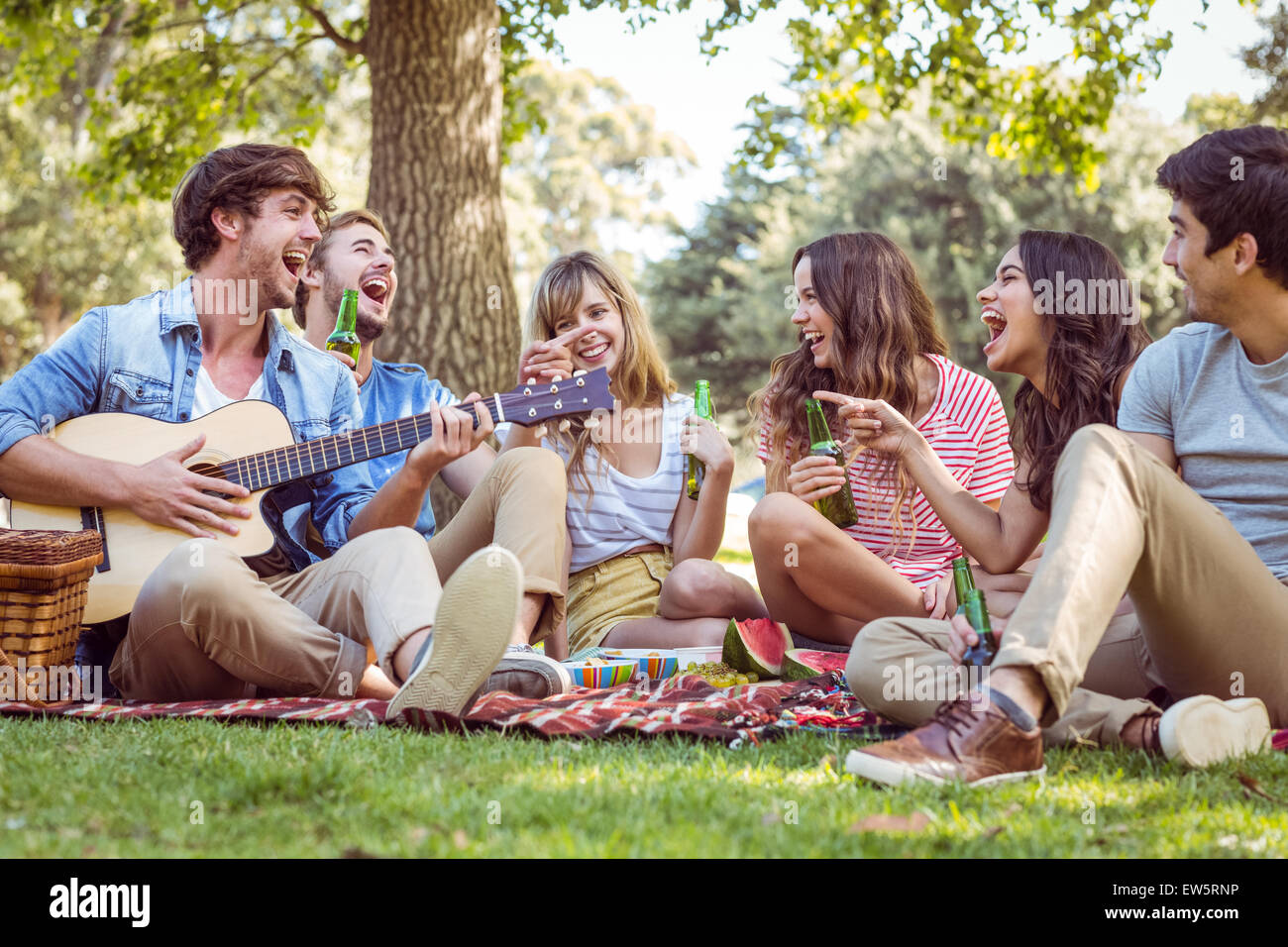 Happy friends in the park Stock Photo - Alamy