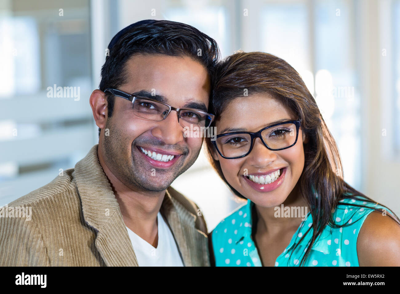 Portrait of smiling partners posing together Stock Photo - Alamy