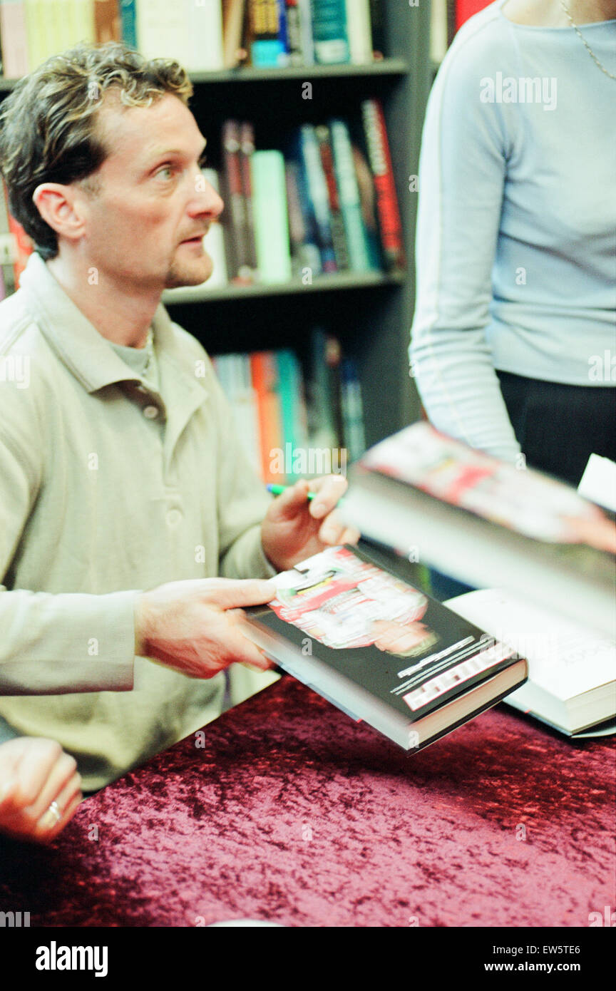 Carl Fogarty, four times World Superbike Champion, signing copies of ...