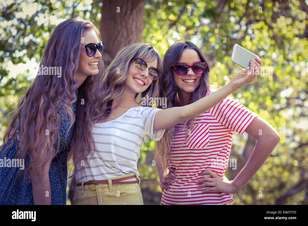 Happy friends taking a selfie Stock Photo - Alamy
