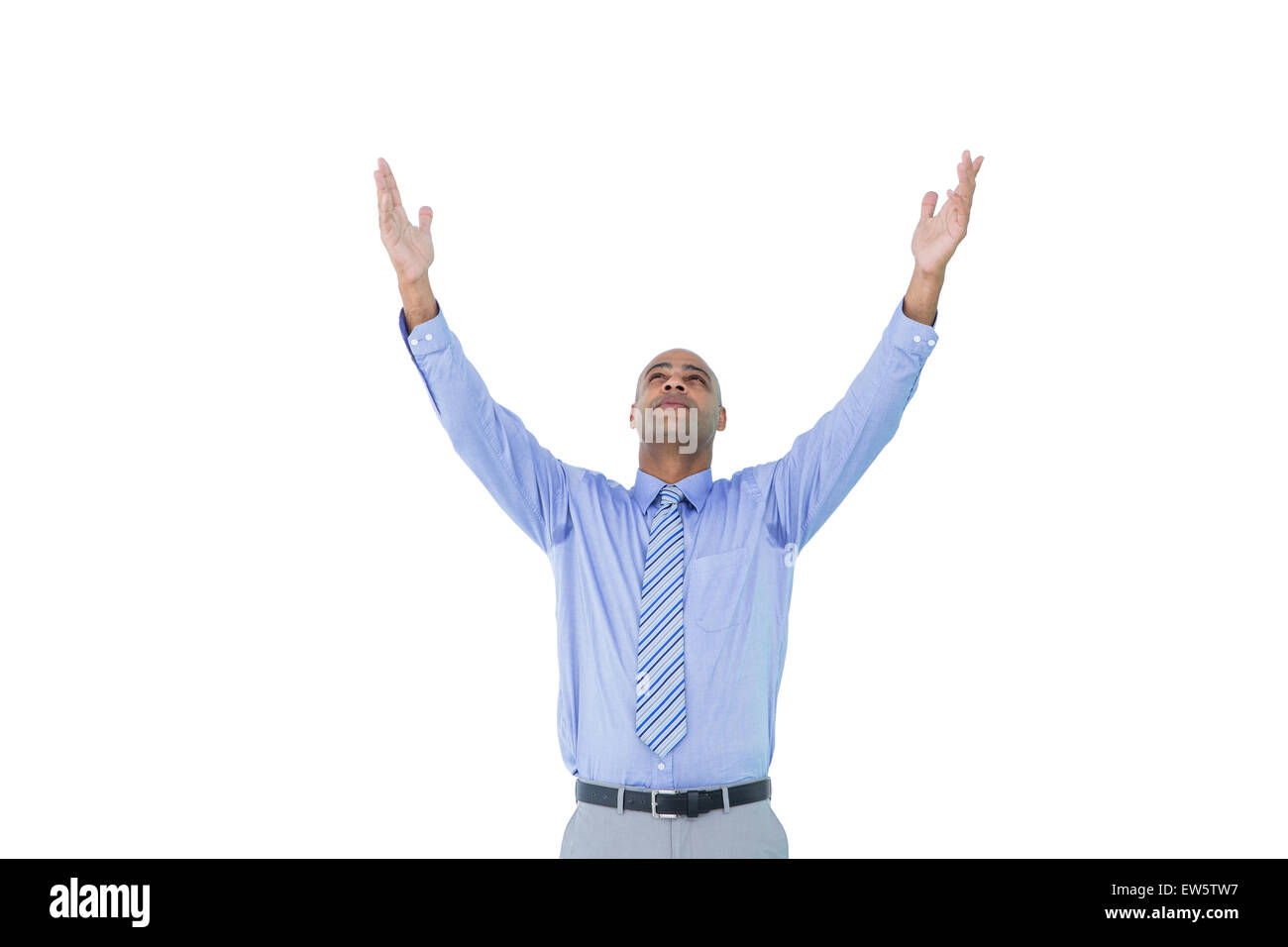 A concentrated businessman with arms up Stock Photo - Alamy
