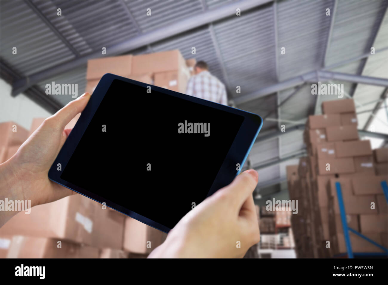 Composite image of hands holding tablet Stock Photo - Alamy