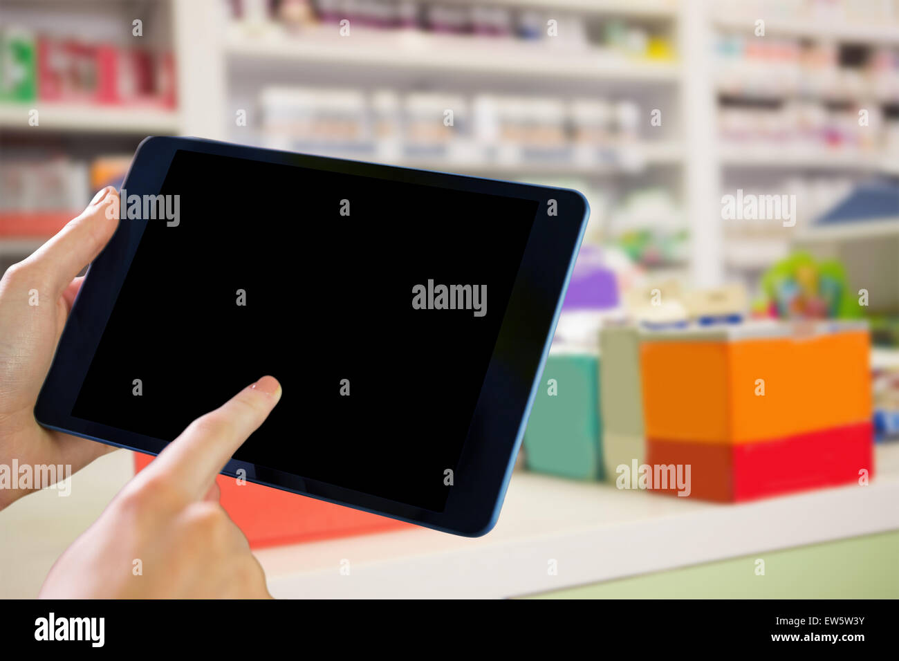 Composite image of man using tablet pc Stock Photo - Alamy