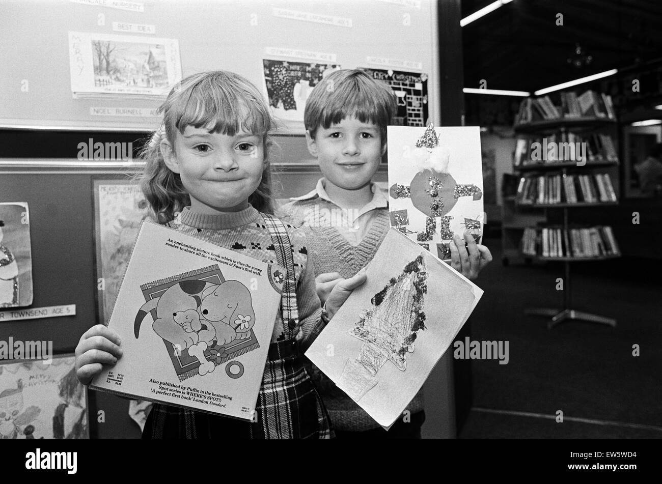 Children holing their entries for a Christmas card competition ...