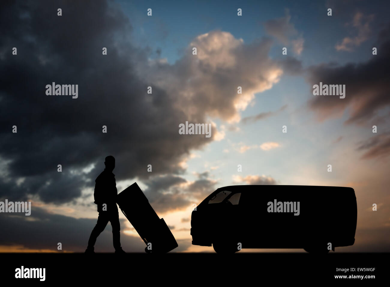 Composite image of happy delivery man pushing trolley of boxes Stock ...