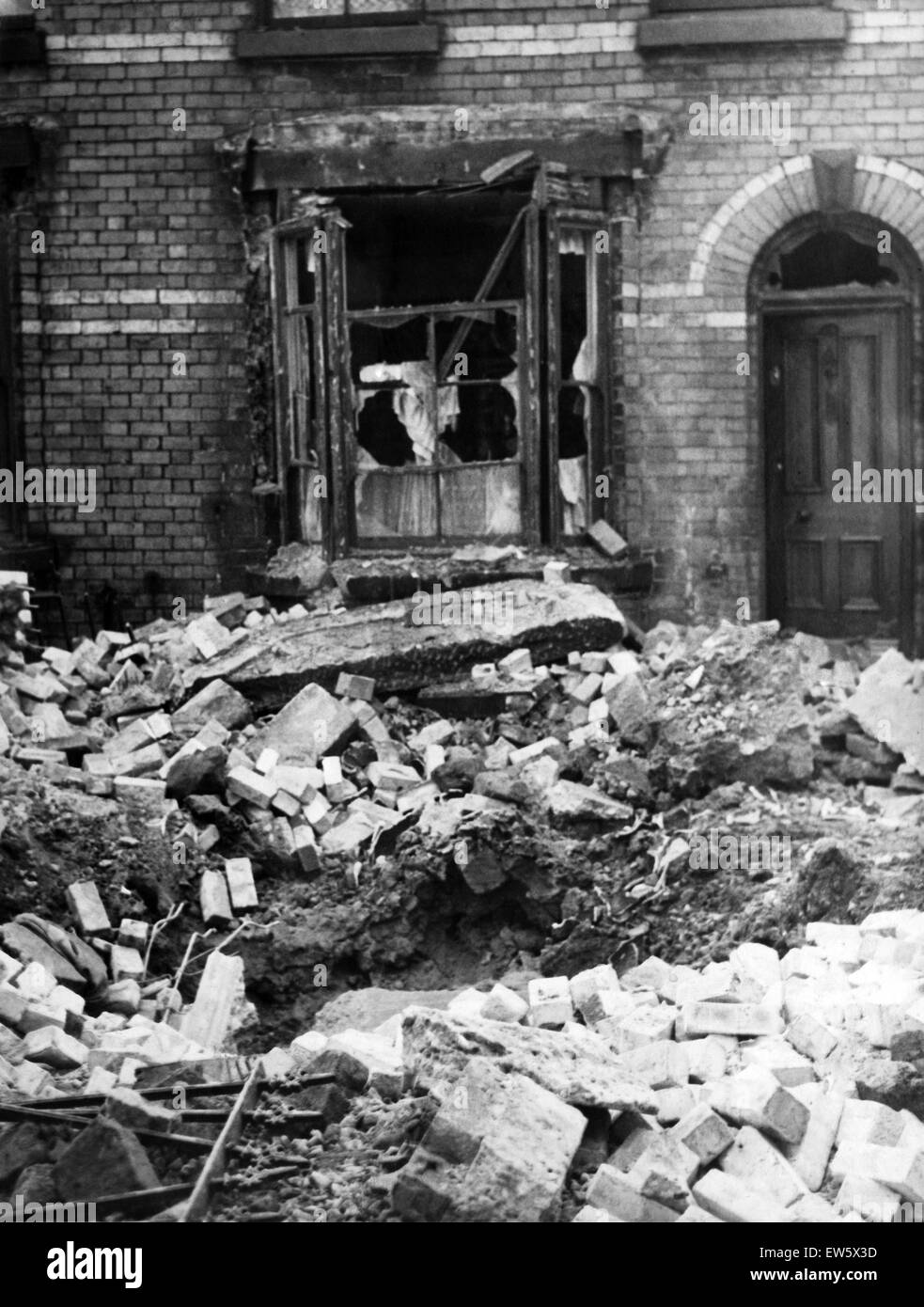 Bomb damage in Liverpool. A large crater in Stevenson Street, Liverpool ...