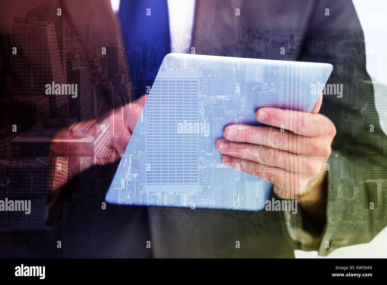 Composite image of businessman scrolling on his digital tablet Stock ...