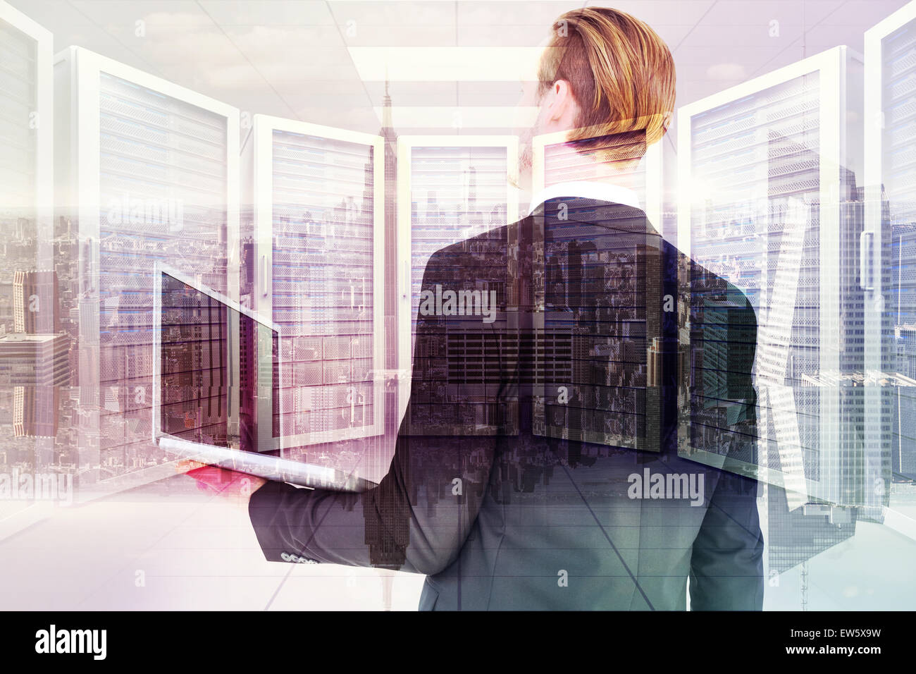 Composite image of businessman looking up holding laptop Stock Photo ...