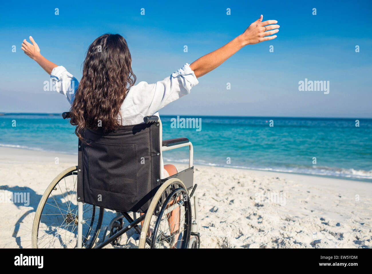 Disabled woman with arms outstretched at the beach Stock Photo - Alamy