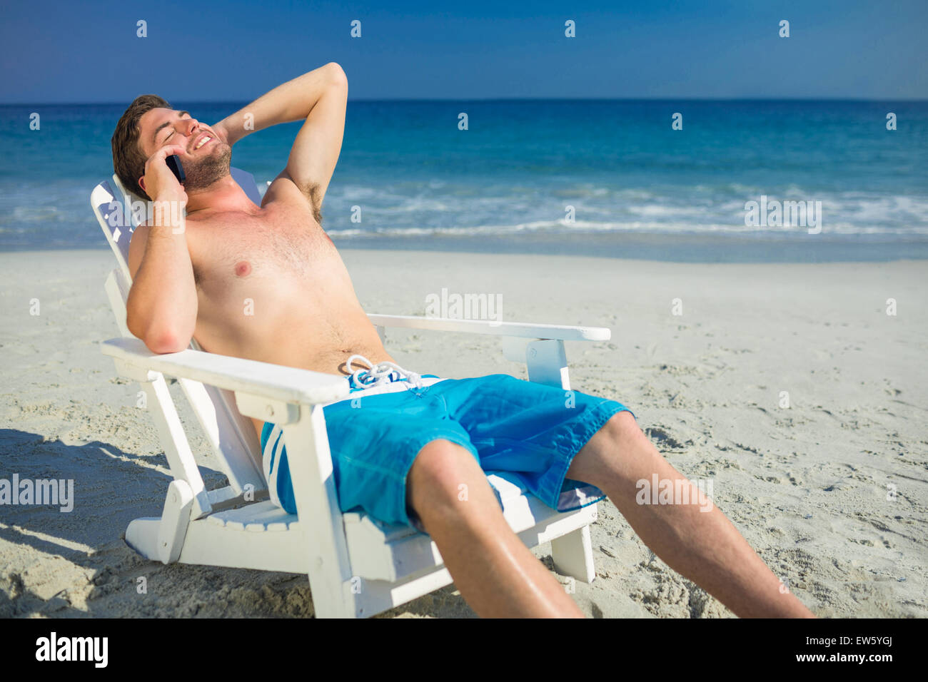 Man having phone call at the beach Stock Photo - Alamy