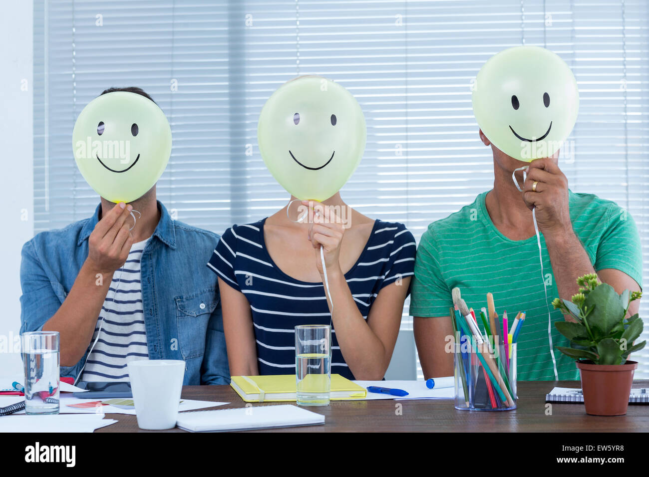 Casual people sitting on couch with smile head Stock Photo - Alamy