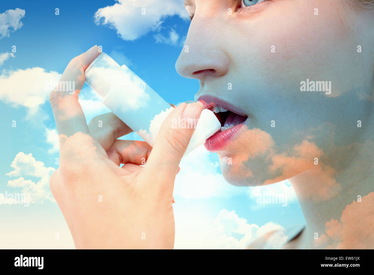 Composite image of blonde woman taking her inhaler Stock Photo - Alamy