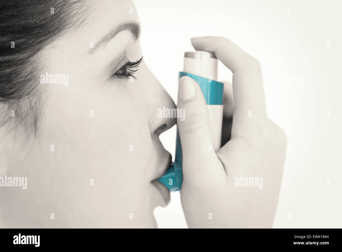 Woman with an asthma inhaler Stock Photo - Alamy