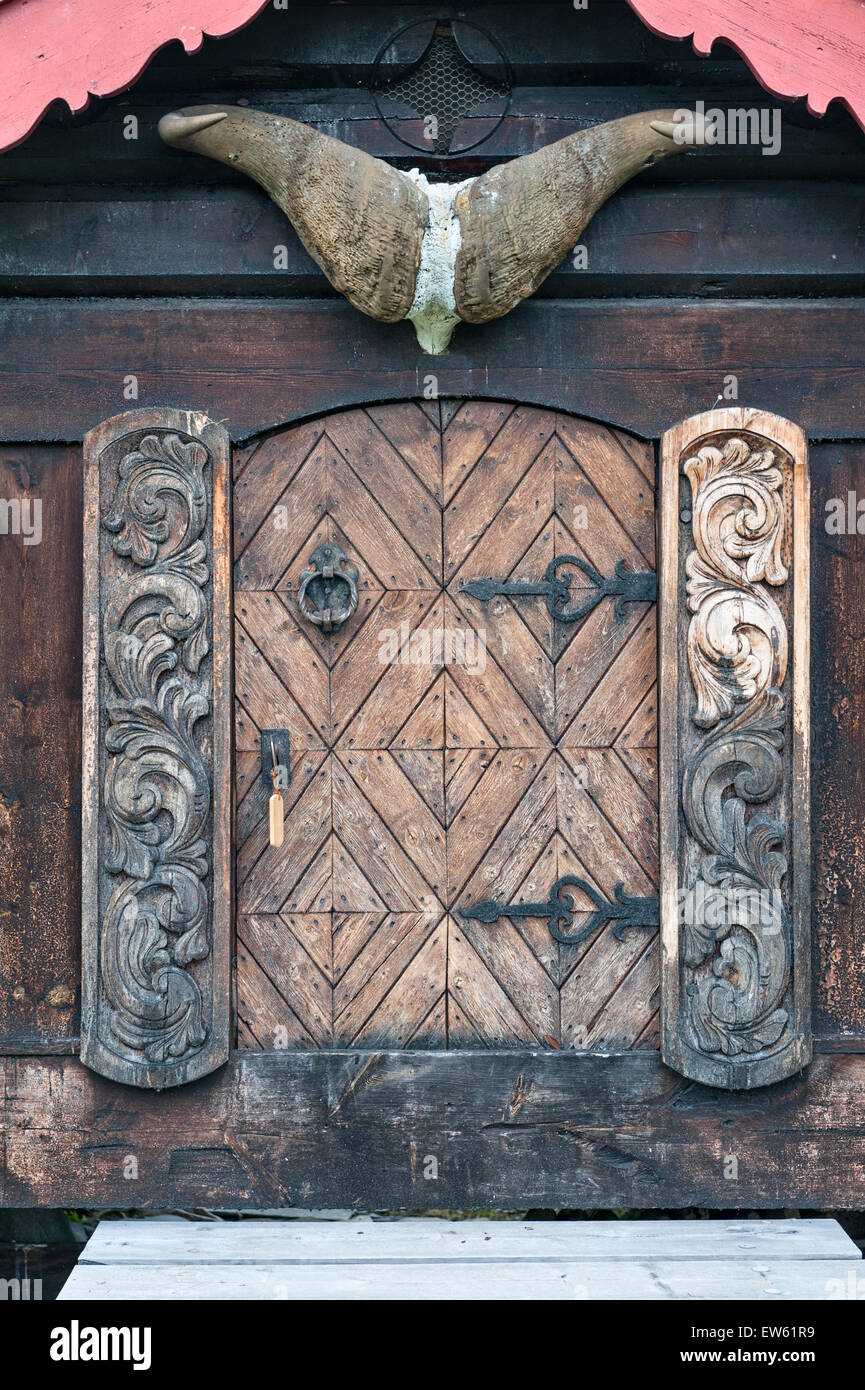 Norway. A traditional mountain hut (hytte) decorated with ram's horns ...