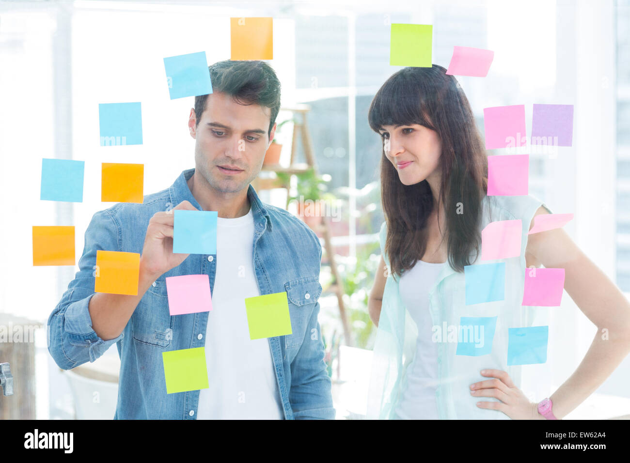 Young creative business people writing photo editor Stock Photo - Alamy