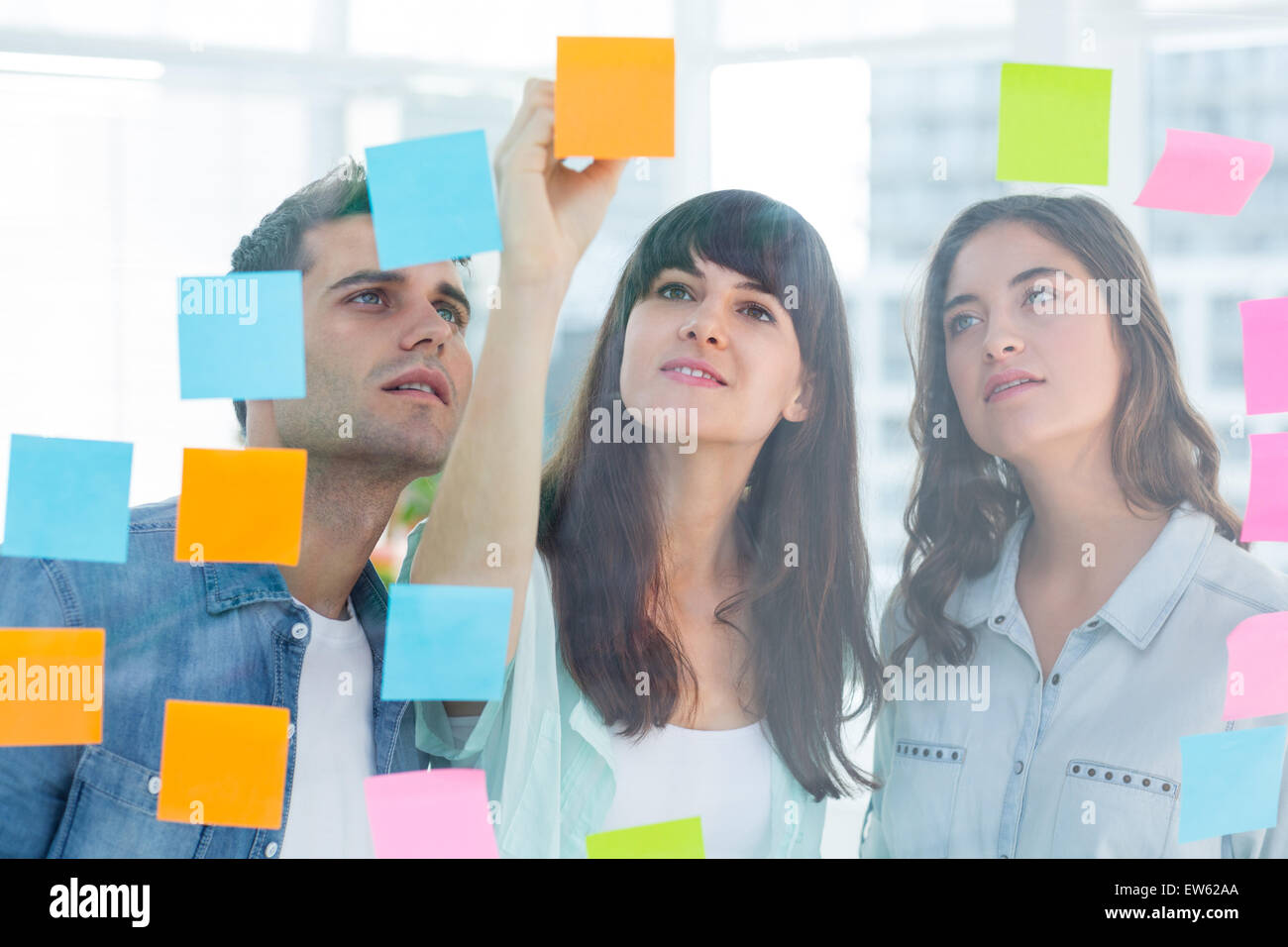 Young creative business people writing photo editor Stock Photo - Alamy