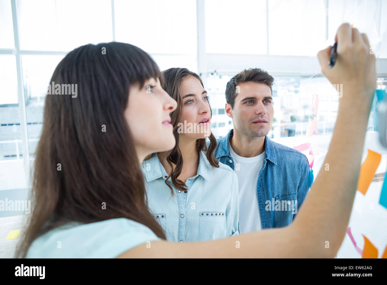 Young creative business people writing photo editor Stock Photo - Alamy