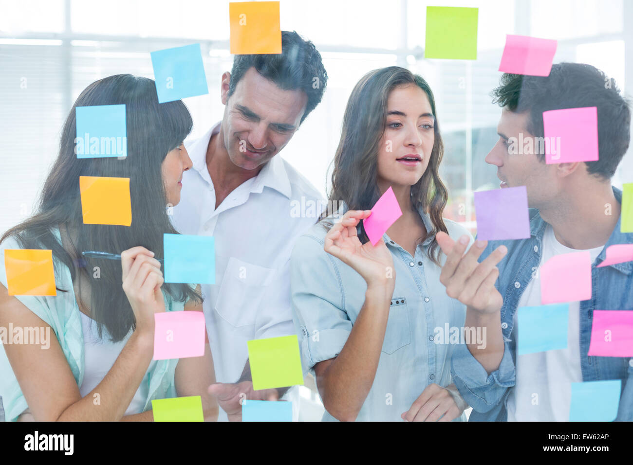 Young creative business people writing photo editor Stock Photo - Alamy