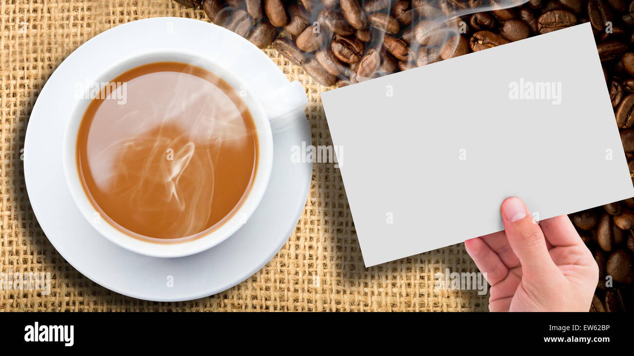 Composite image of hand showing card Stock Photo - Alamy