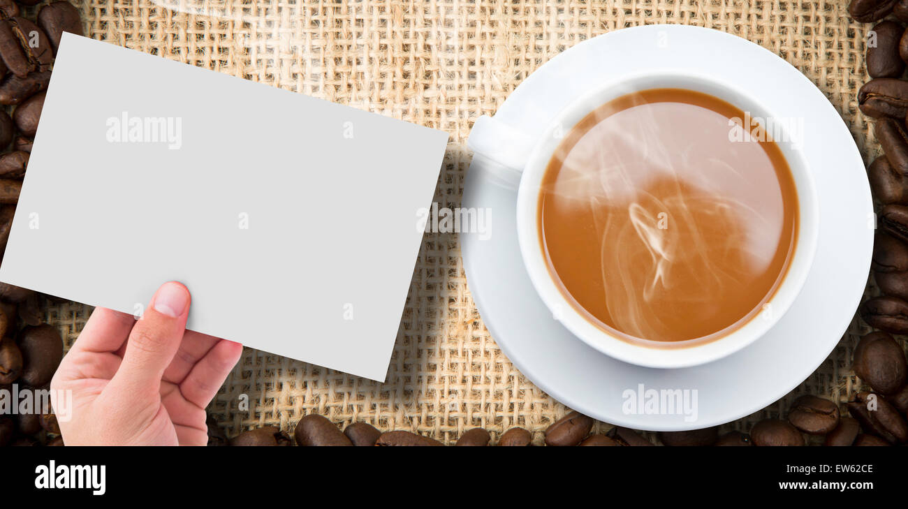 Composite image of hand showing card Stock Photo - Alamy