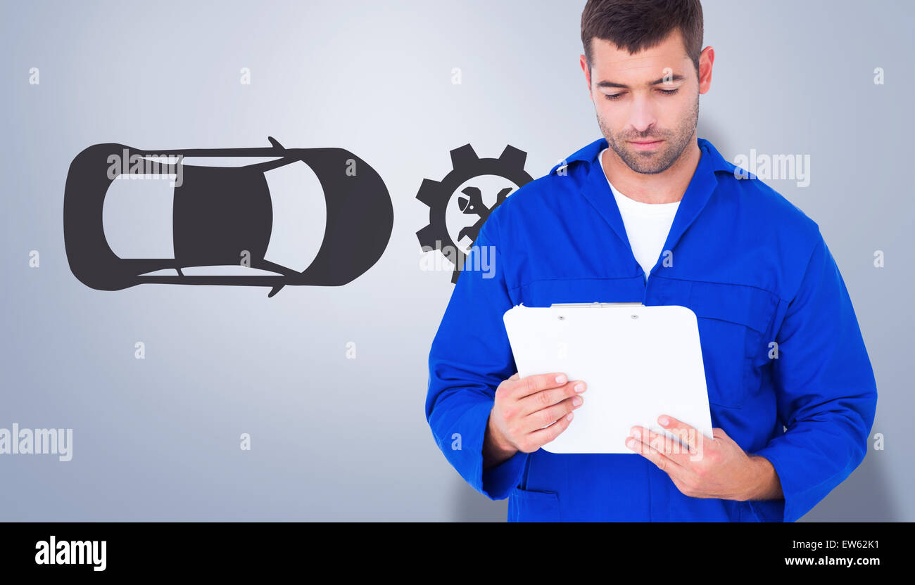 Composite image of mechanic reading clipboard Stock Photo - Alamy