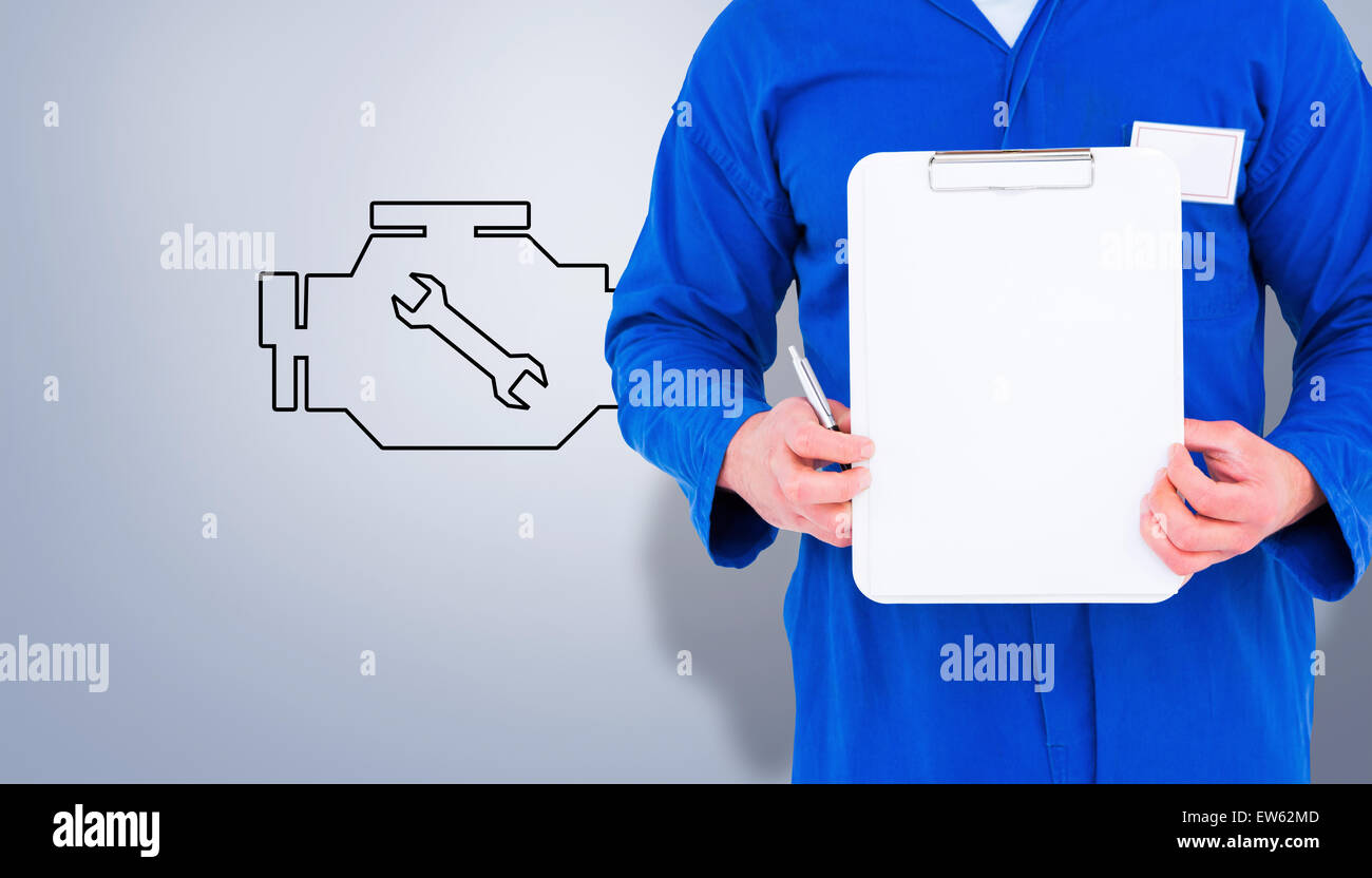 Composite image of male mechanic holding clipboard Stock Photo - Alamy