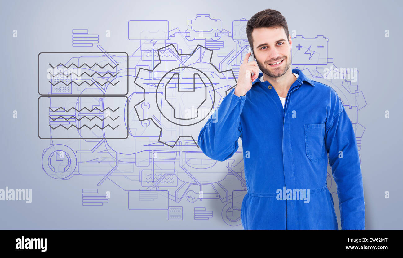 Composite image of smiling male mechanic using mobile phone Stock Photo ...