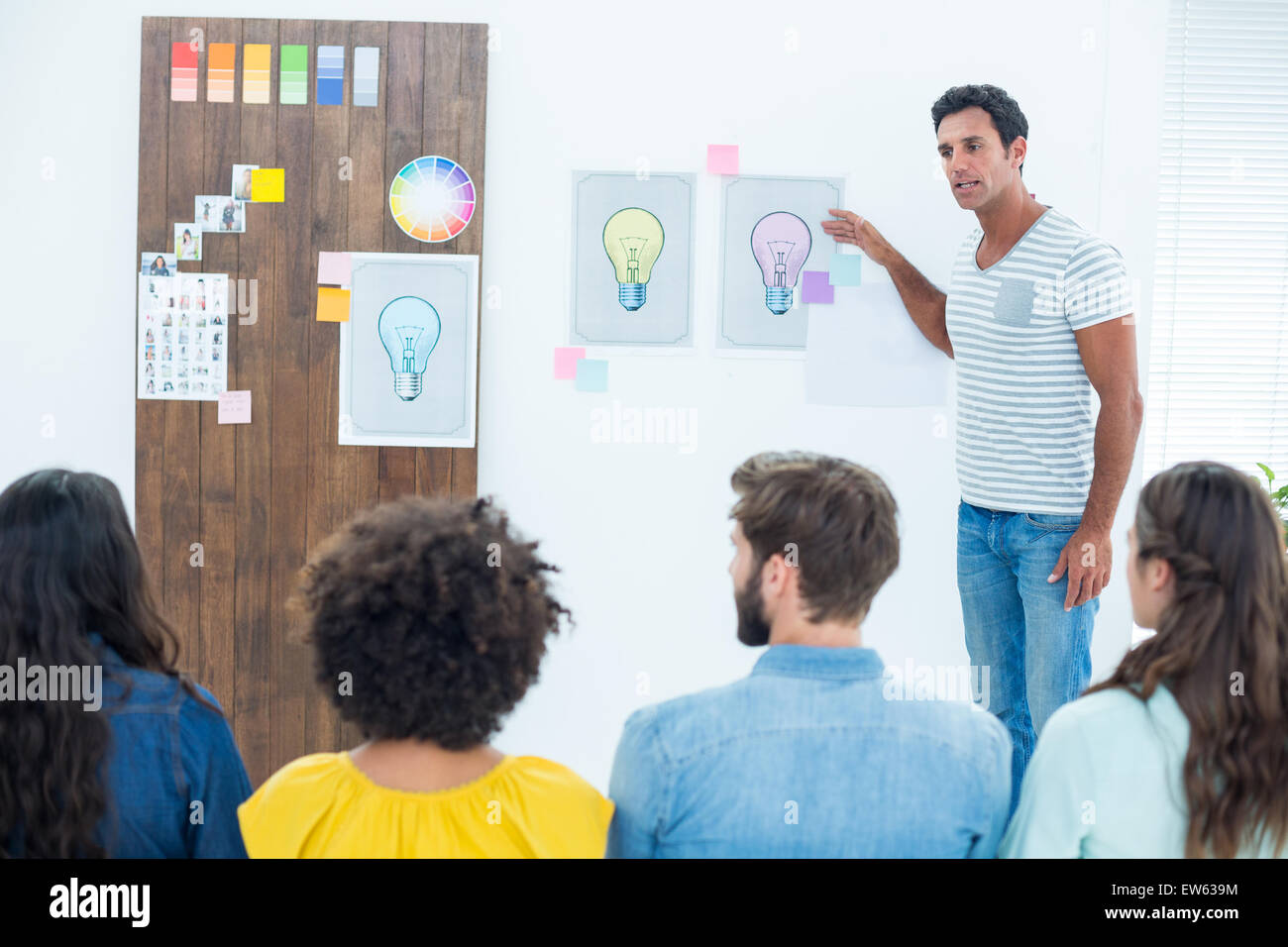 Creative business people at work by blackboard Stock Photo - Alamy