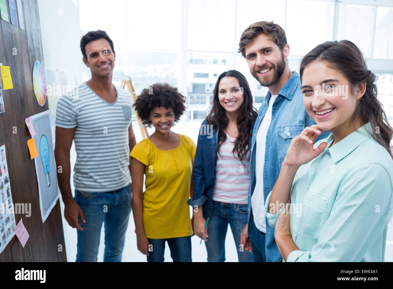 Young creative business people at work by blackboard Stock Photo - Alamy