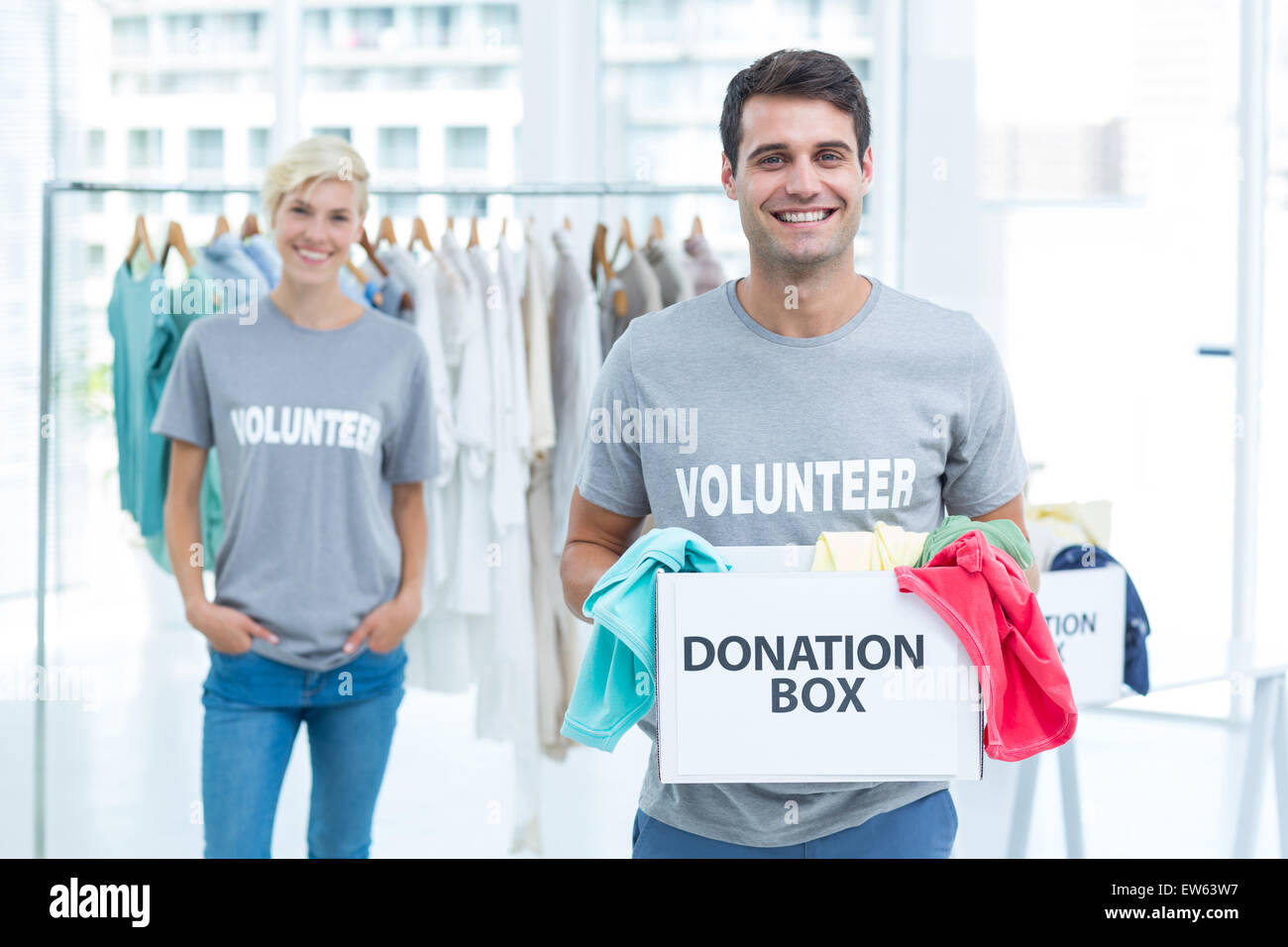 Volunteer man donate box hi-res stock photography and images - Alamy