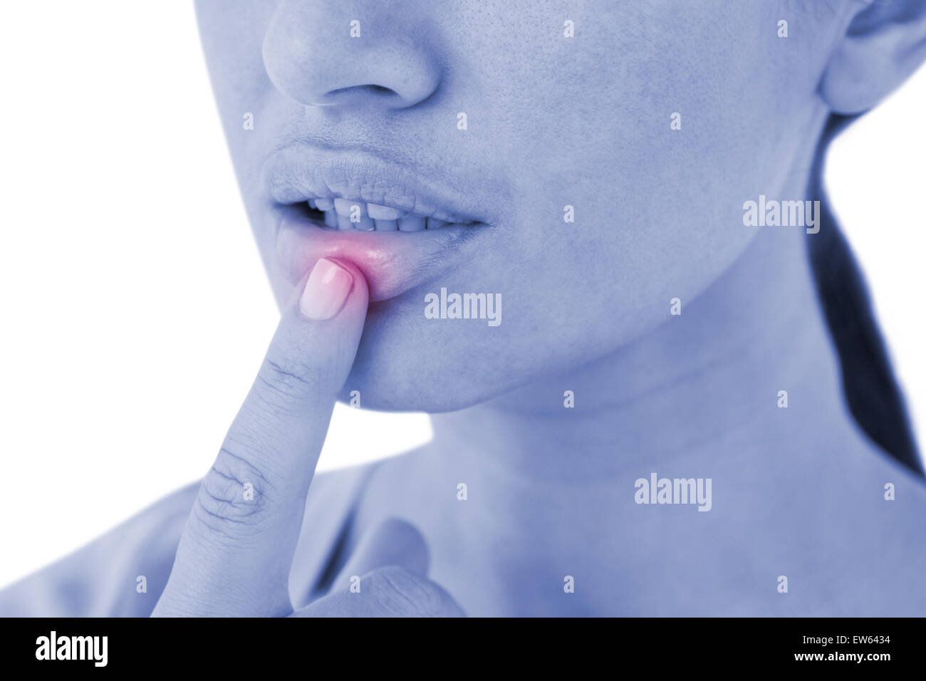 Woman pointing her lip Stock Photo - Alamy