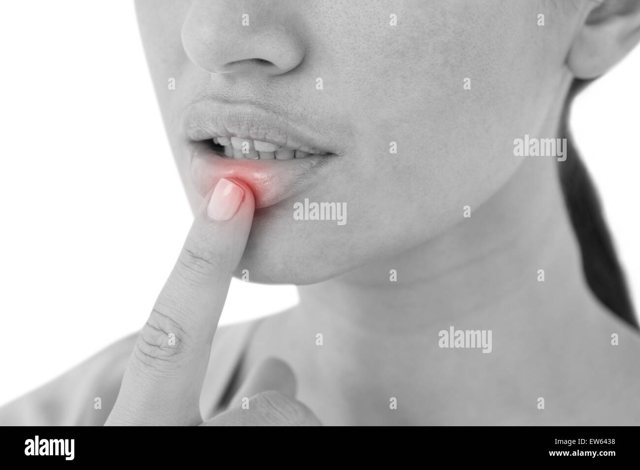 Woman pointing her lip Stock Photo - Alamy