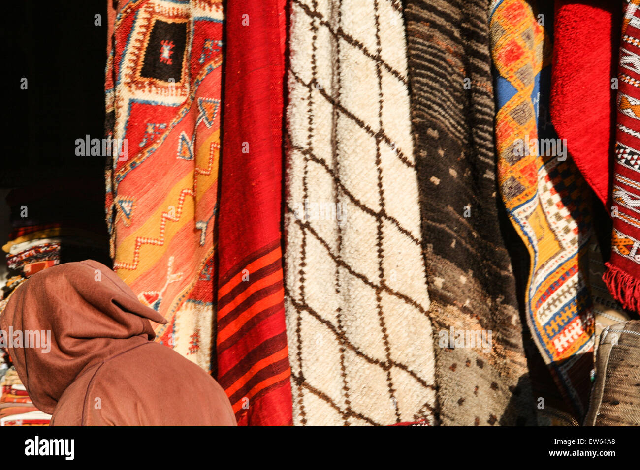 Local man wearing long-hooded cloak known as a djellaba, worn by both ...