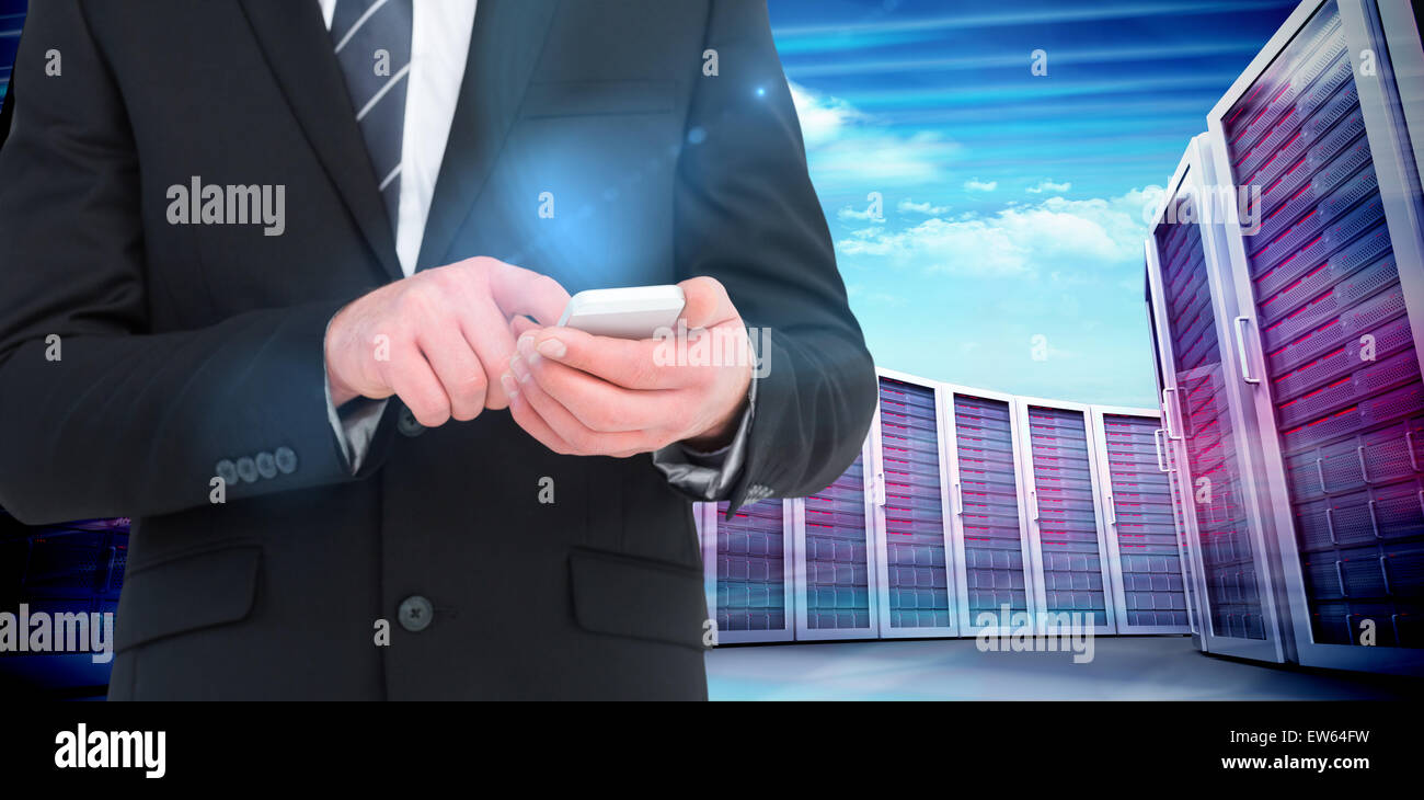 Composite image of businessman sending a text message Stock Photo - Alamy