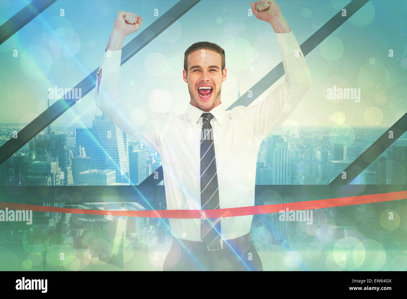 Composite image of businessman crossing the finish line and cheering ...