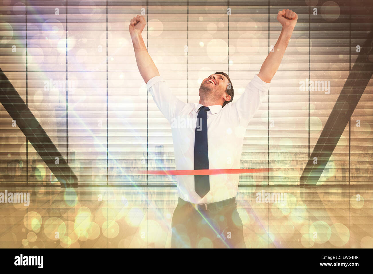 Composite image of businessman celebrating success with arms up Stock ...