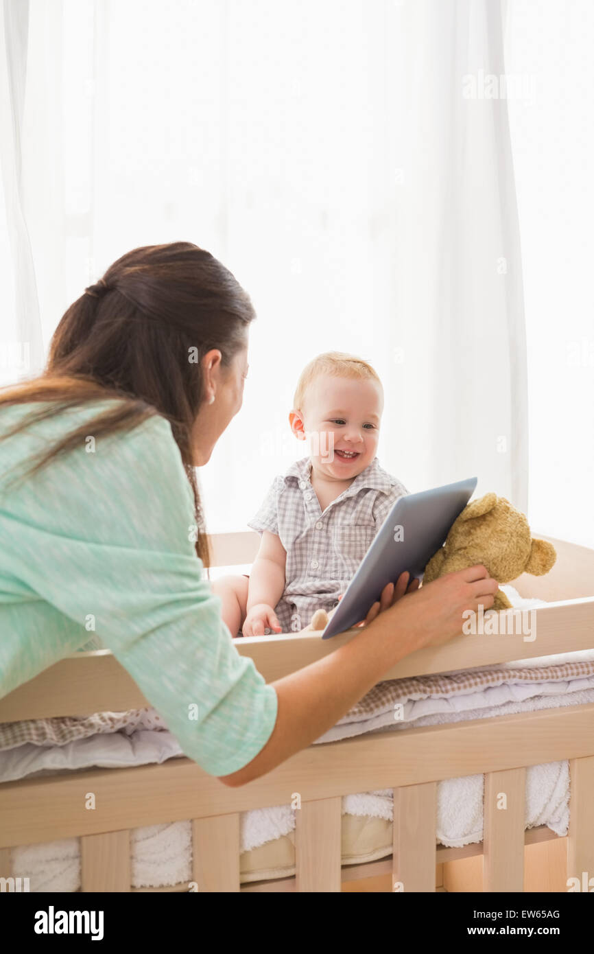 Mother interacting baby playing teddy hi-res stock photography and ...