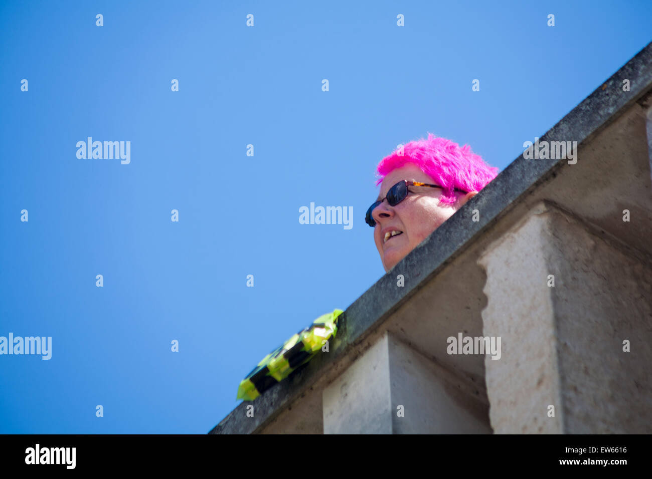 Woman looking over wall hi-res stock photography and images - Alamy
