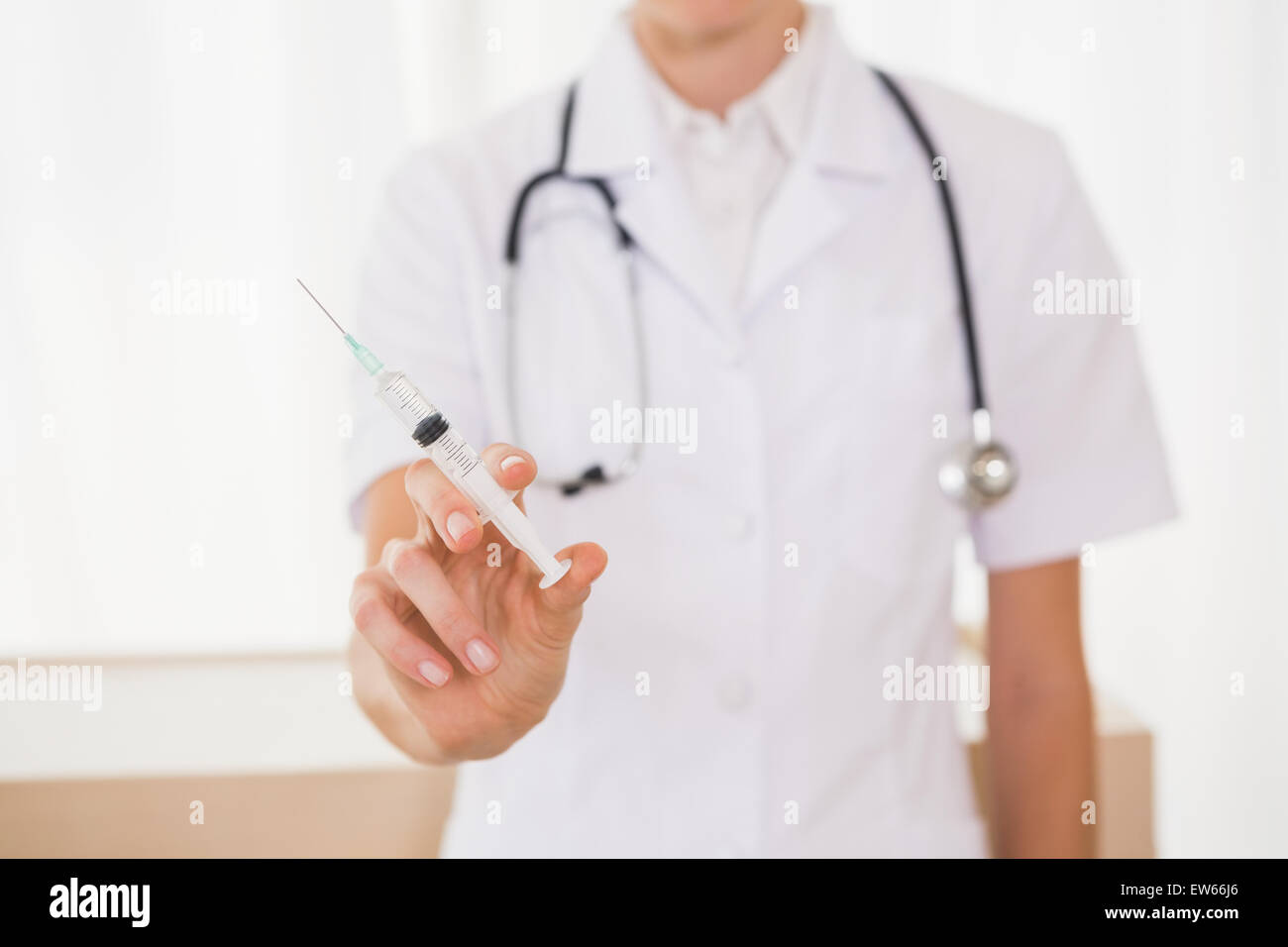 A doctor taking a syringe with needle Stock Photo - Alamy