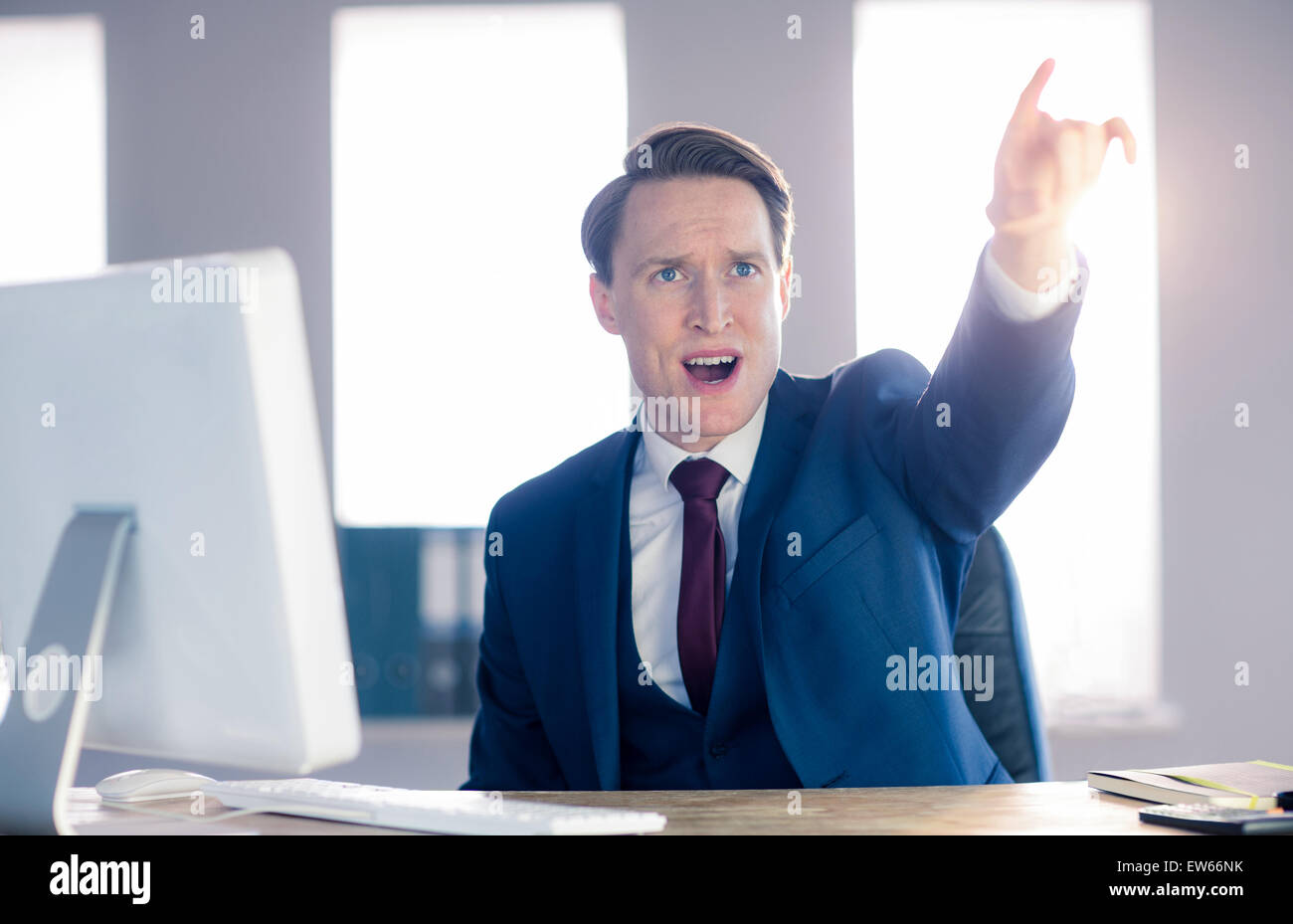 Angry businessman pointing and shouting Stock Photo - Alamy
